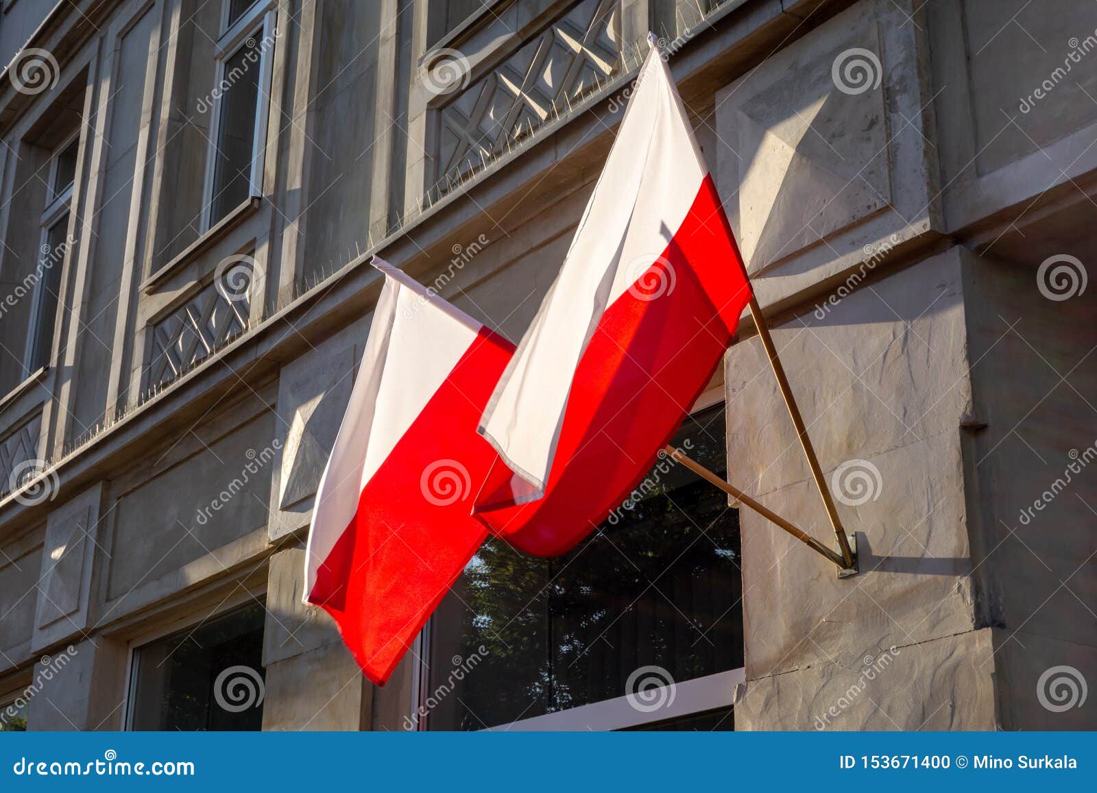 Two Polish National Flags on a Building in a Slight Wind Stock Photo ...