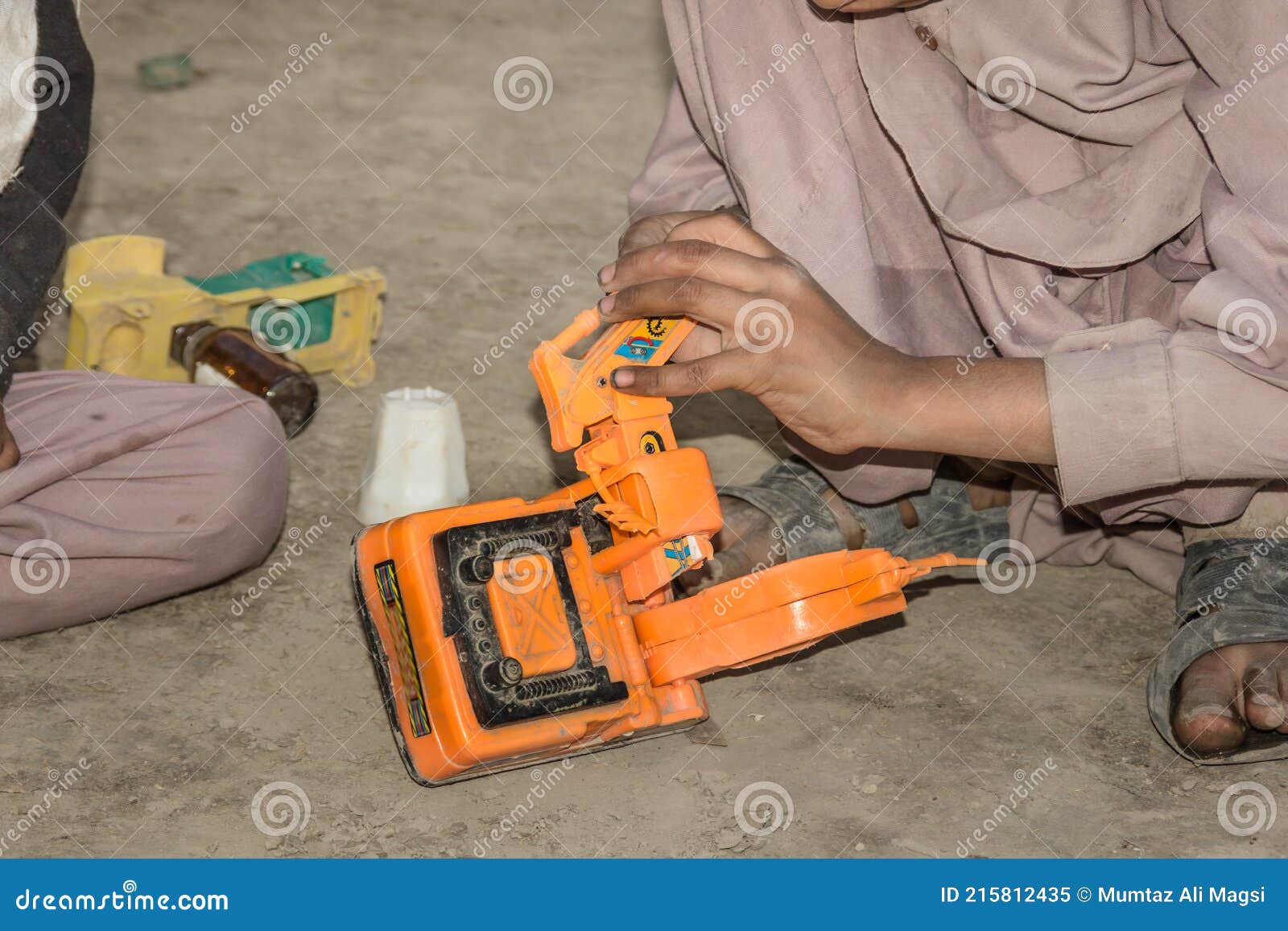 Two Poor Children are Playing with Broken Toys Stock Image - Image of ...