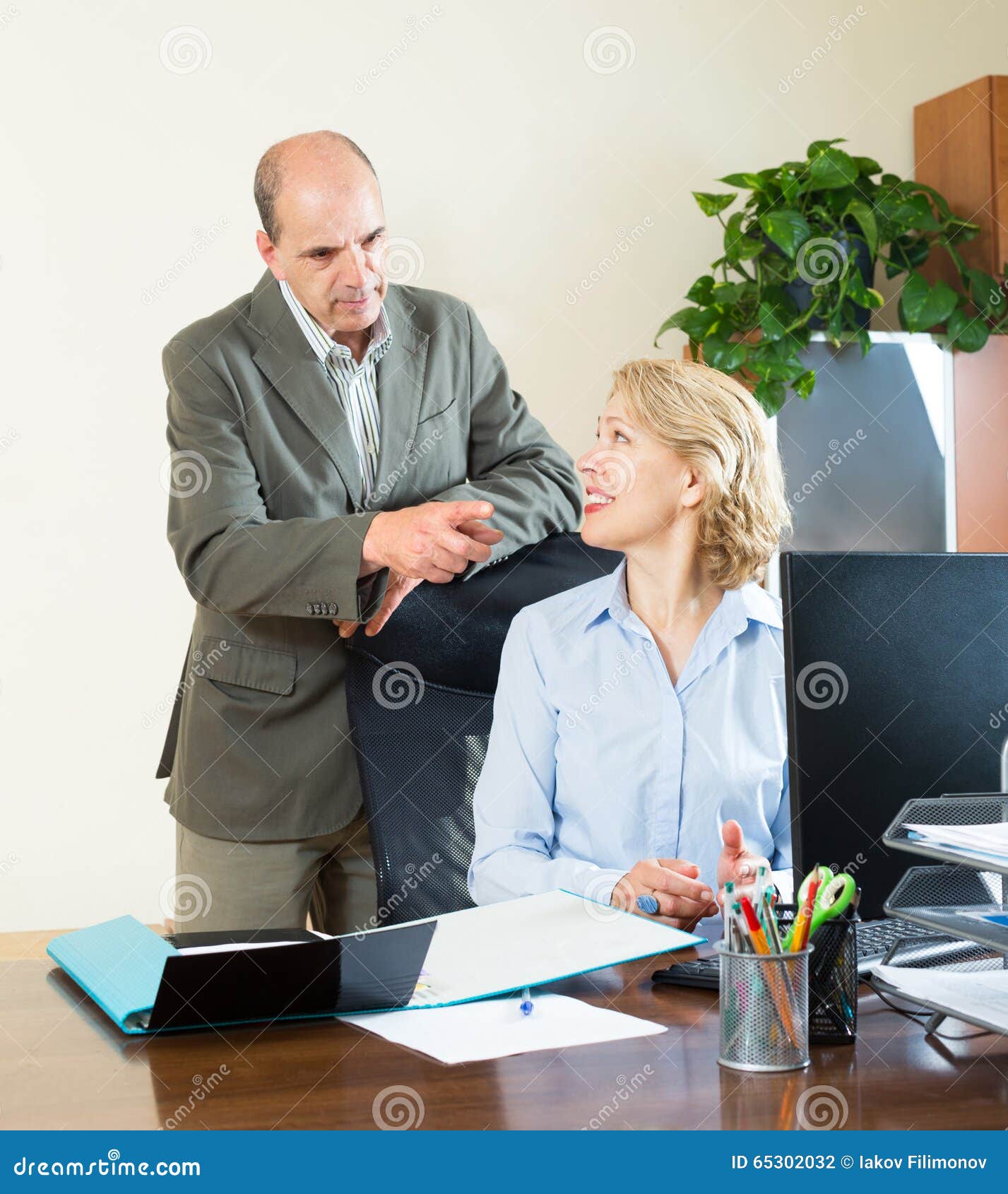 Two positive colleagues stock photo. Image of employee - 65302032