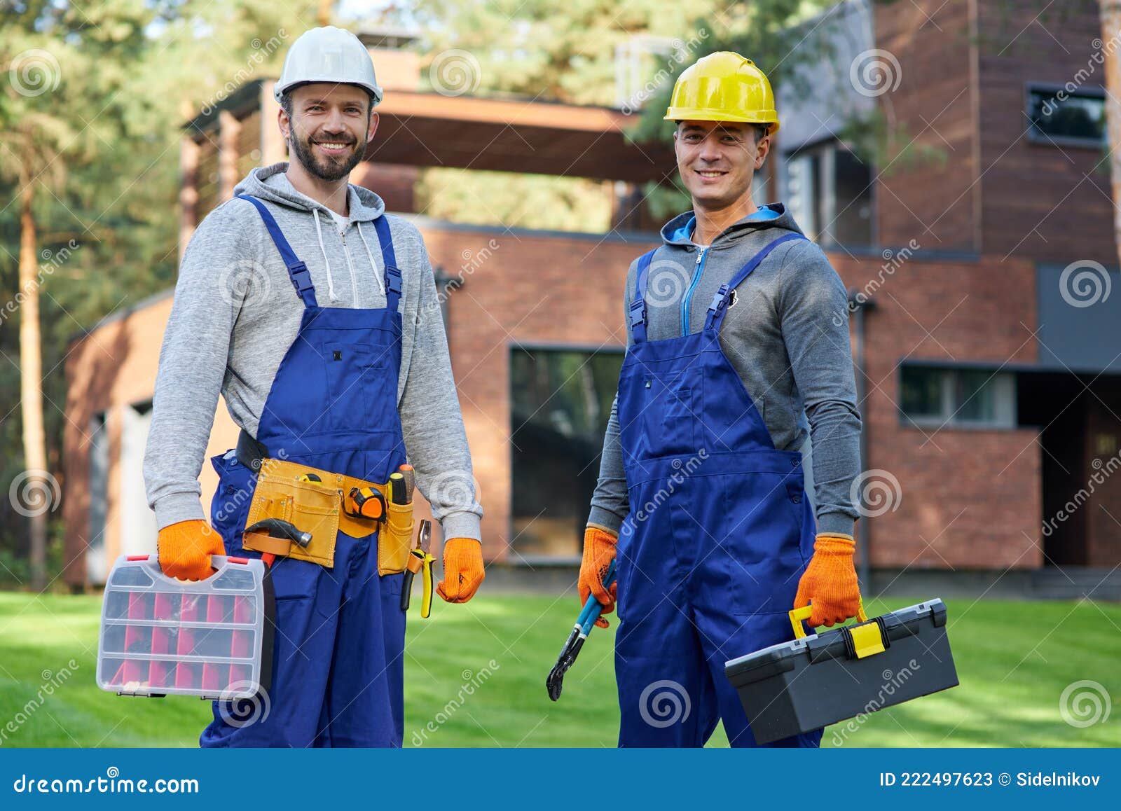 Rely on Us. Two Positive Handsome Young Male Engineers in Hard Hats ...