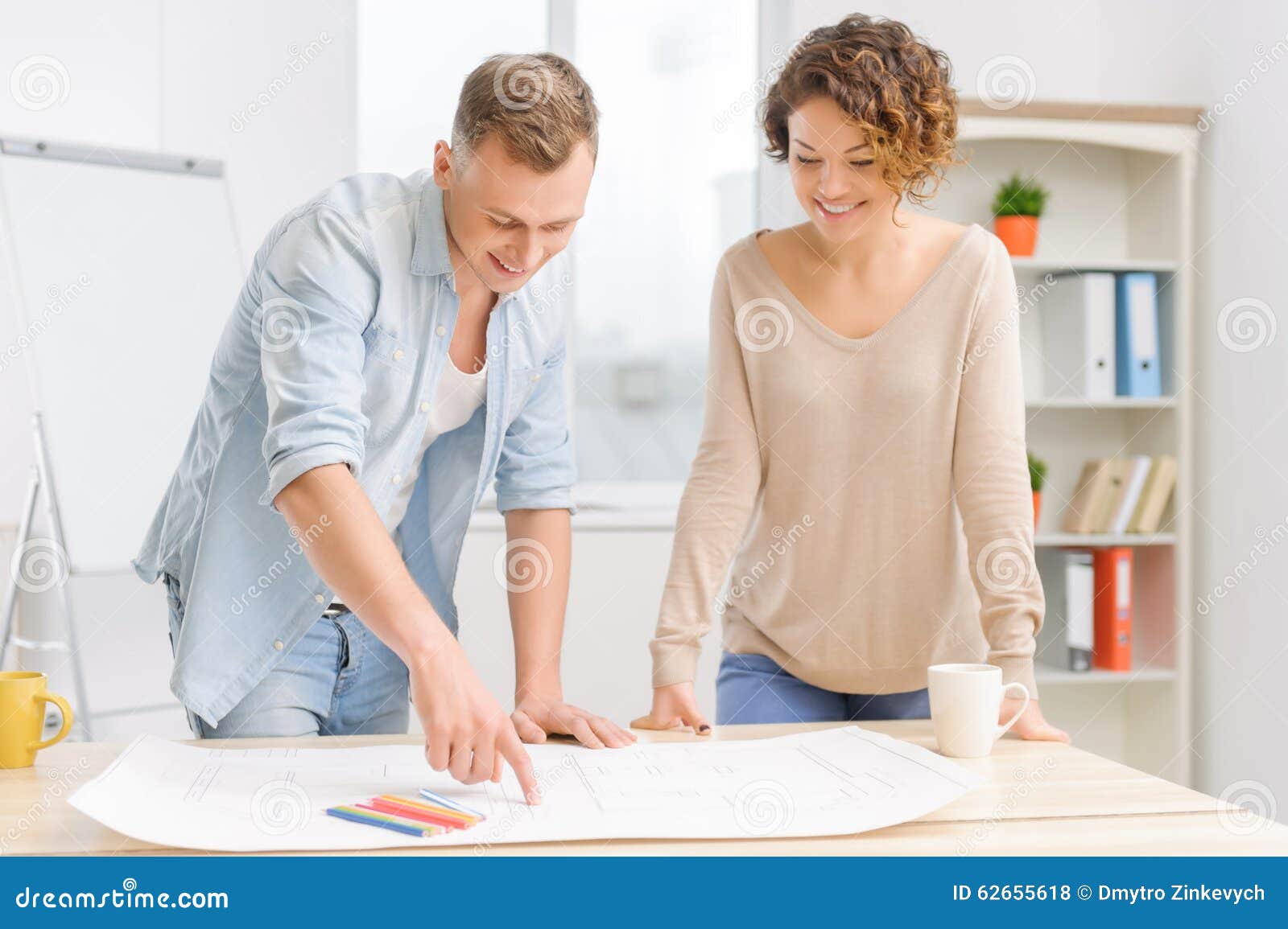 Two Positive Partners are Collaborating Over a Stock Photo - Image of ...