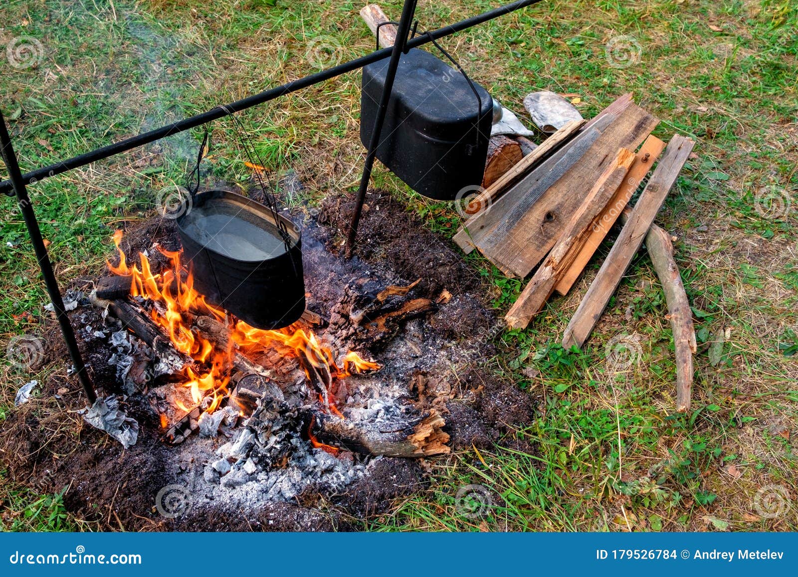 Two Pots by the Fire and Wood during the Hike Stock Photo - Image of ...