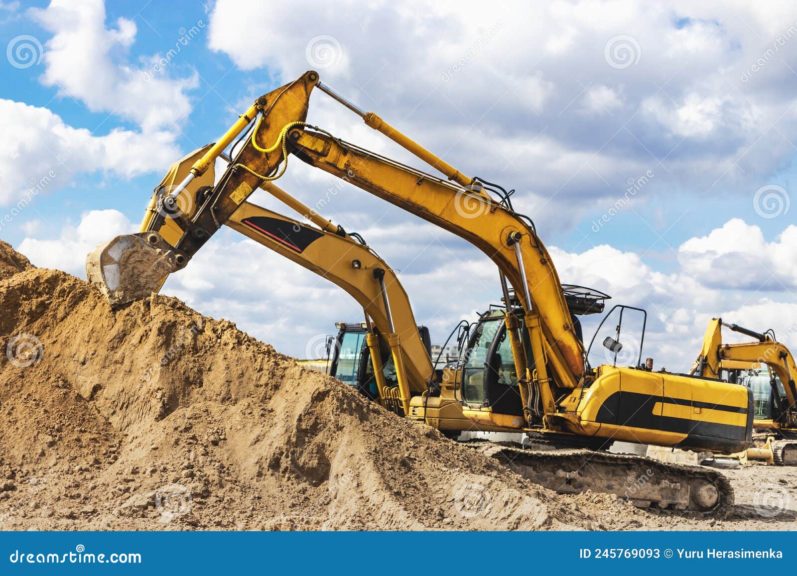Two Powerful Excavators Work at the Same Time on a Construction Site ...
