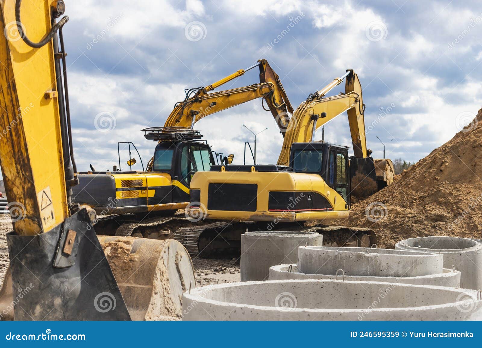 Two Powerful Excavators Work at the Same Time on a Construction Site ...