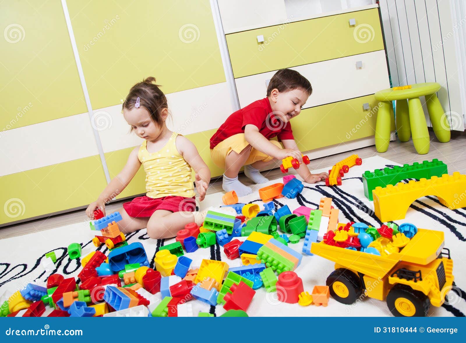 Two Children Build A Prototype Circuit With A Red Laser Controlled By A ...