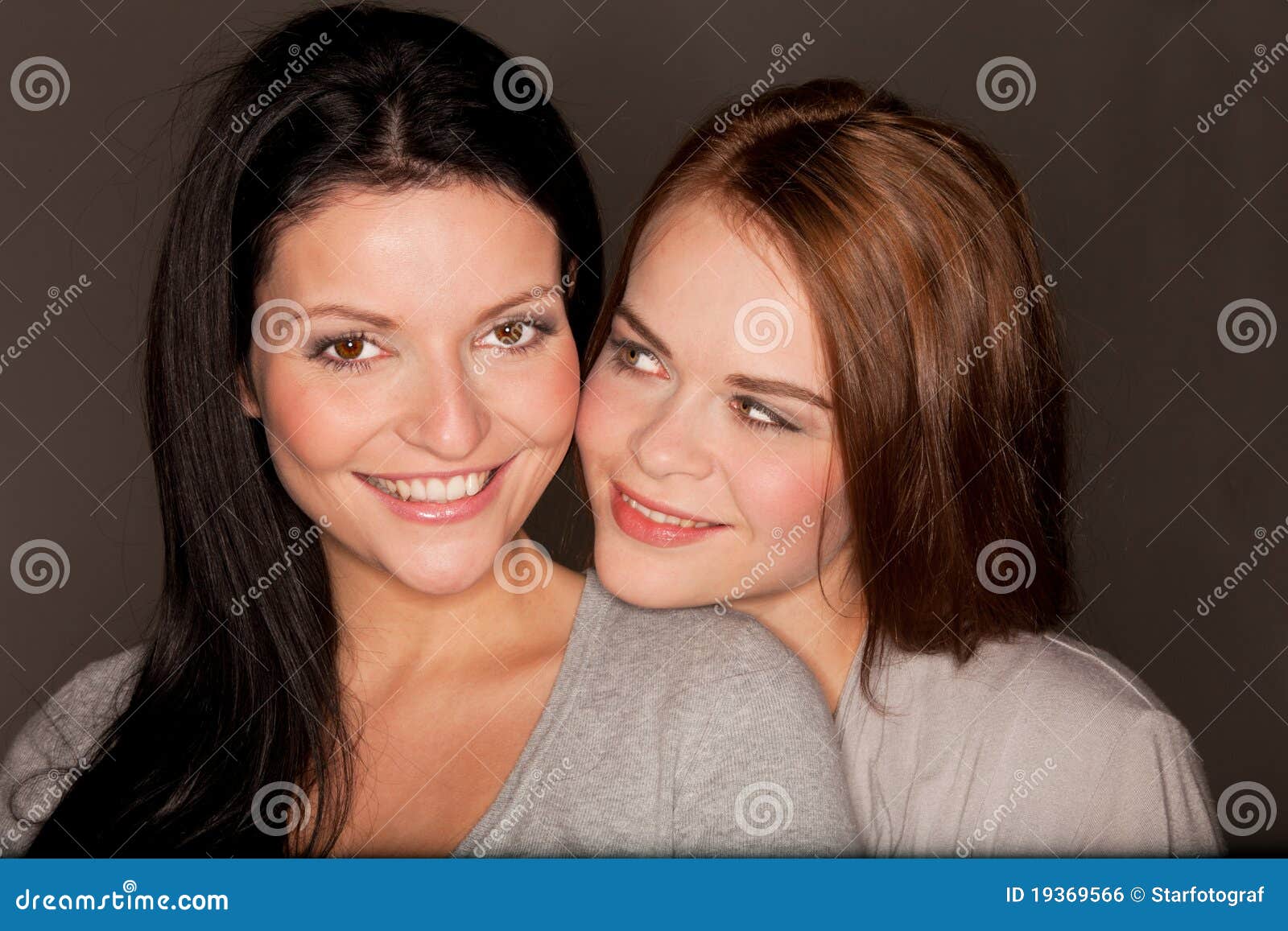 Two pretty girlfriends stock photo. Image of haired, listening - 19369566