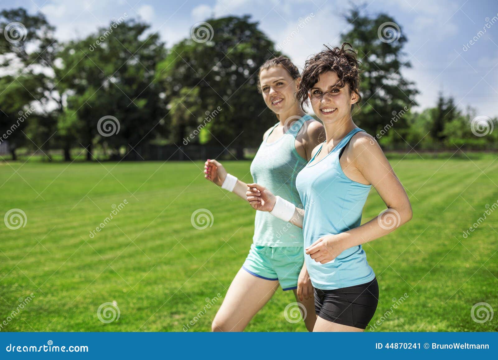 Two pretty girls jogging stock image. Image of outside - 44870241