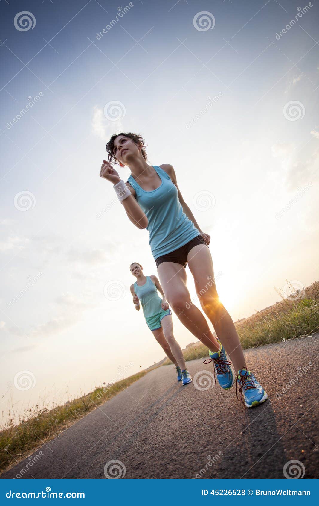 Two pretty girls jogging stock photo. Image of jogger - 45226528