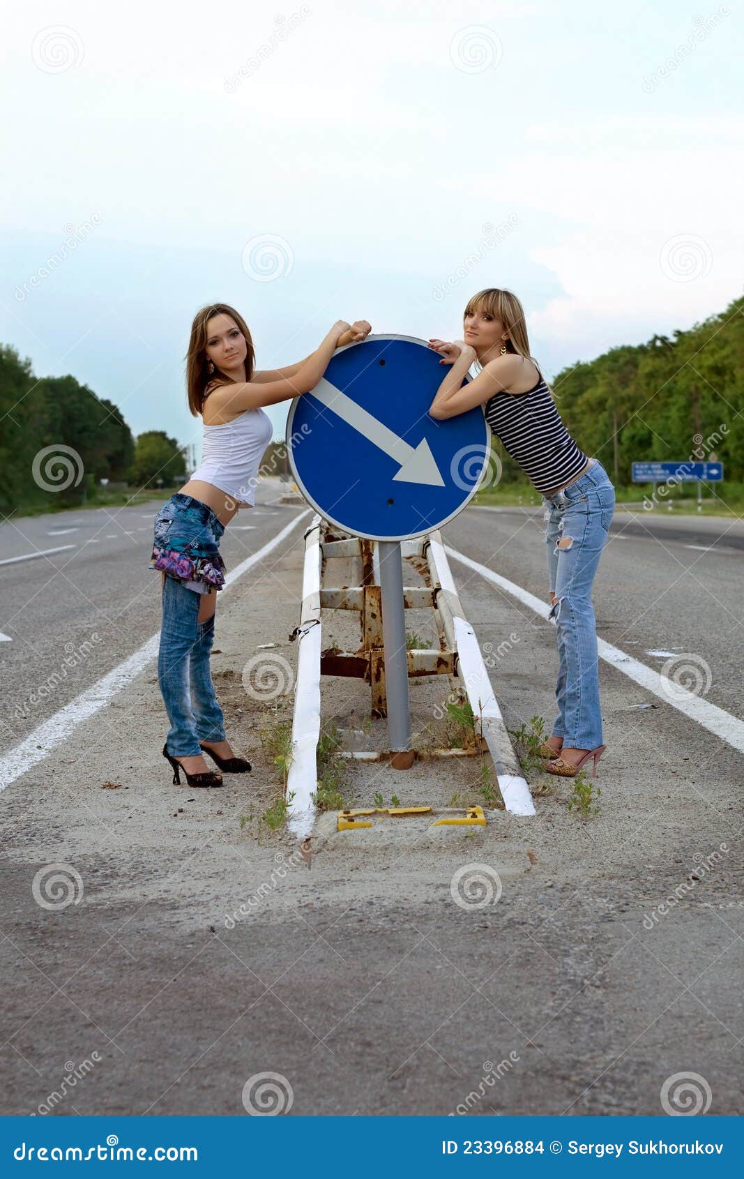 Two Pretty Girls Stand on a Road Stock Photo - Image of blond ...