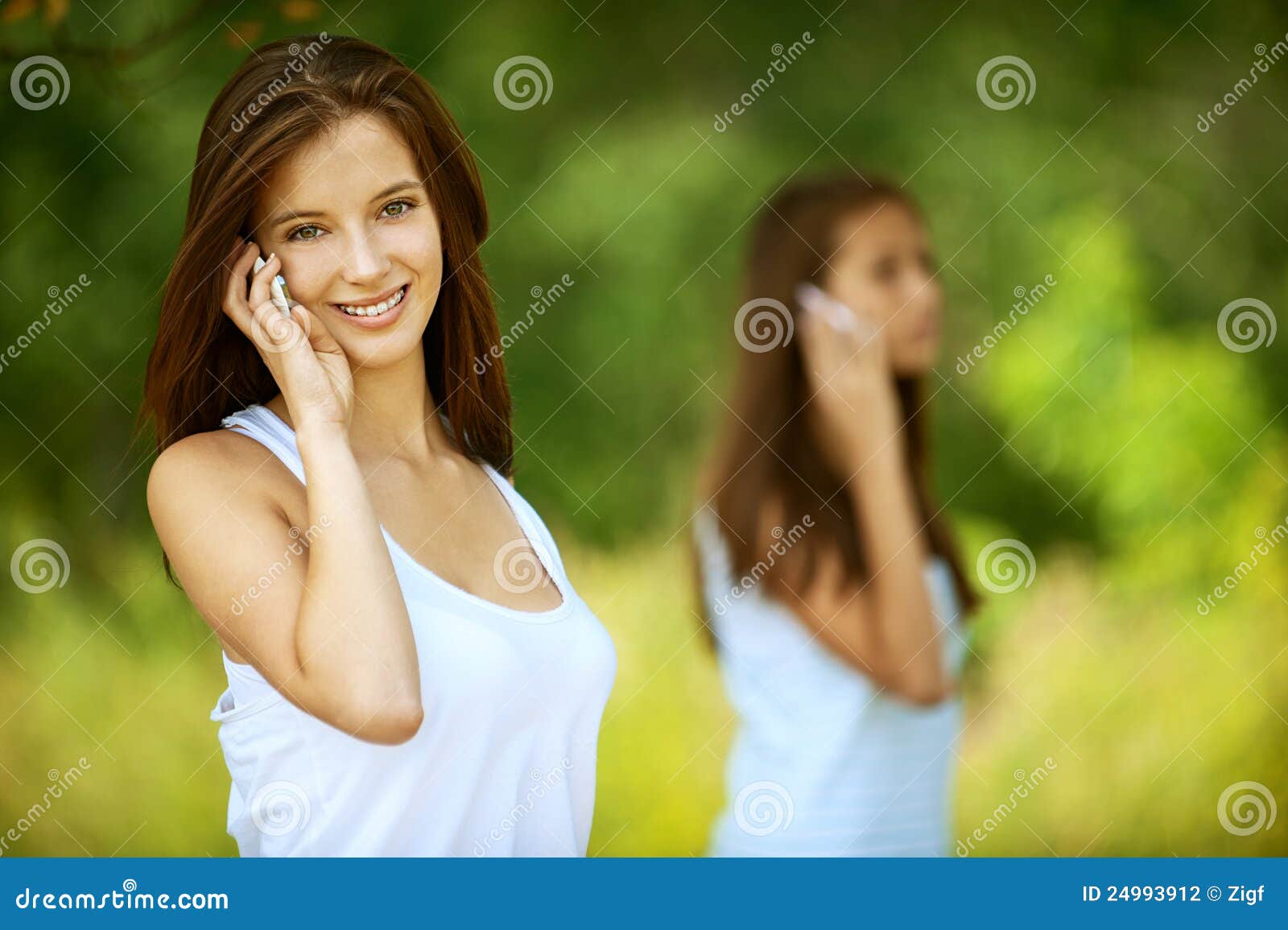 Two Pretty Girls Talking on Cell Stock Photo - Image of modern, enjoy ...