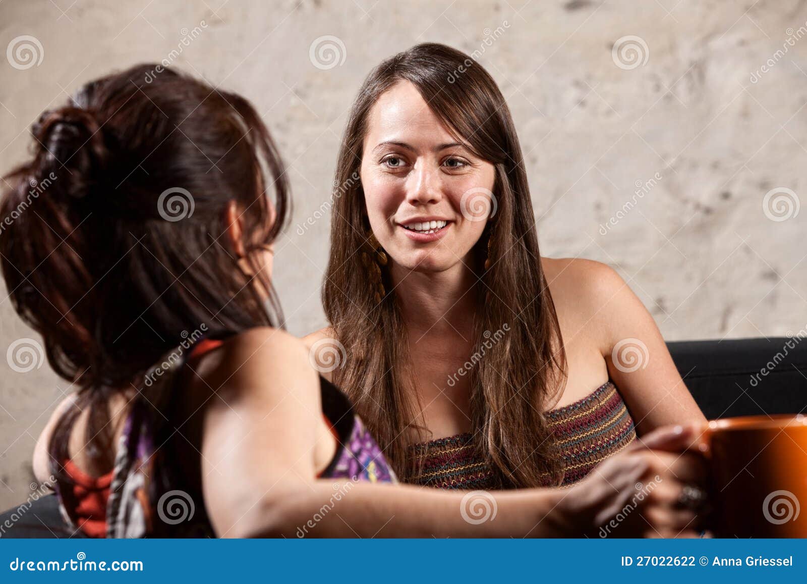 Two Pretty Ladies Talking stock photo. Image of drinking - 27022622