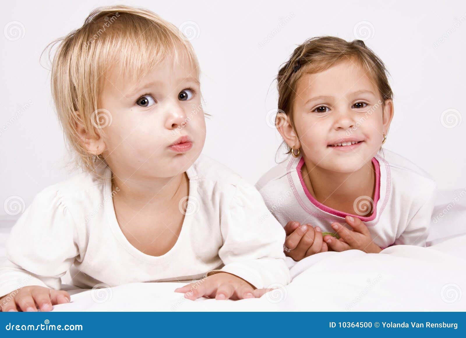 Two pretty little sisters stock photo. Image of blond - 10364500