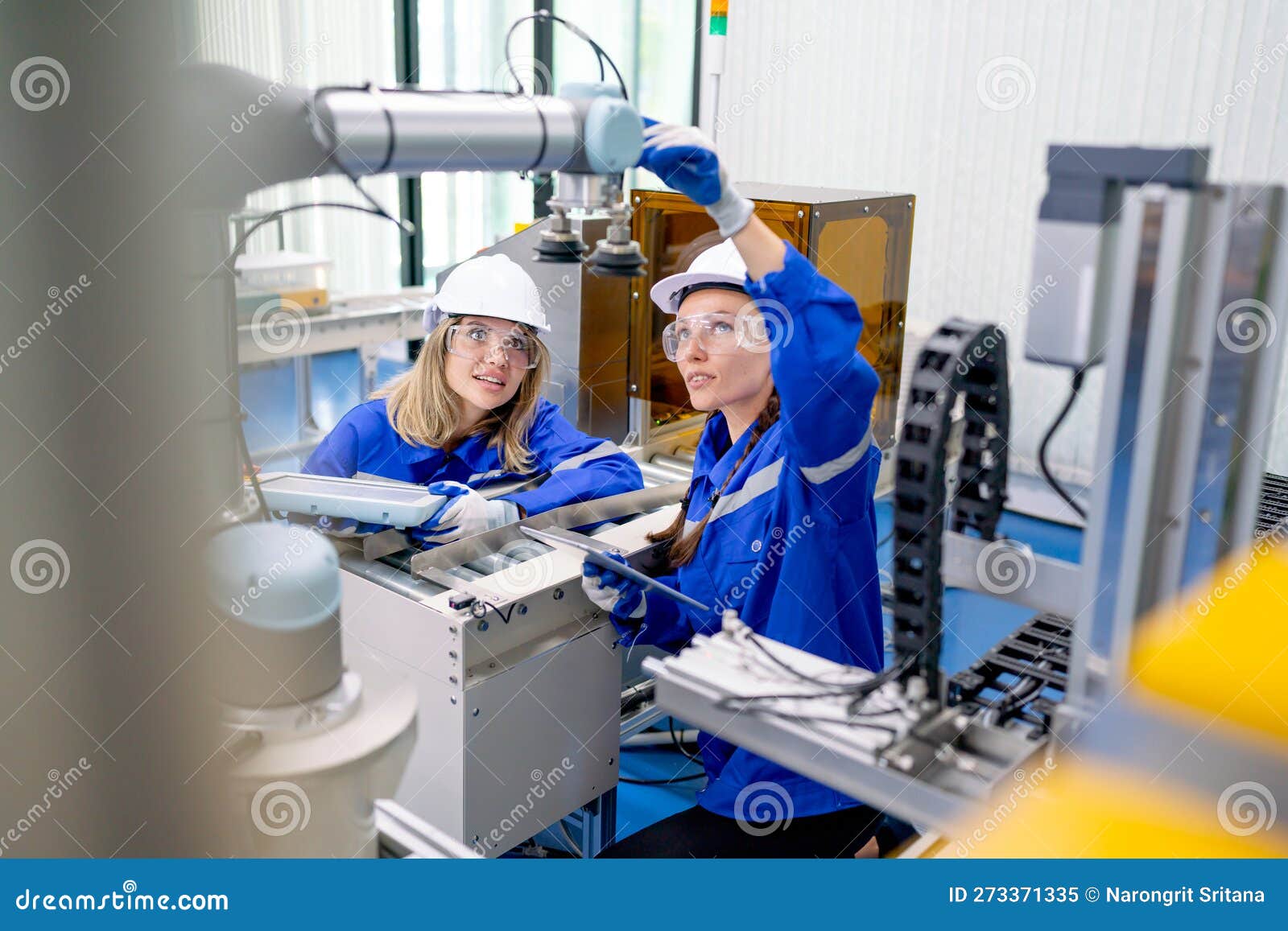 Two Pretty Professional Technician or Engineer Women Sit and Help To ...