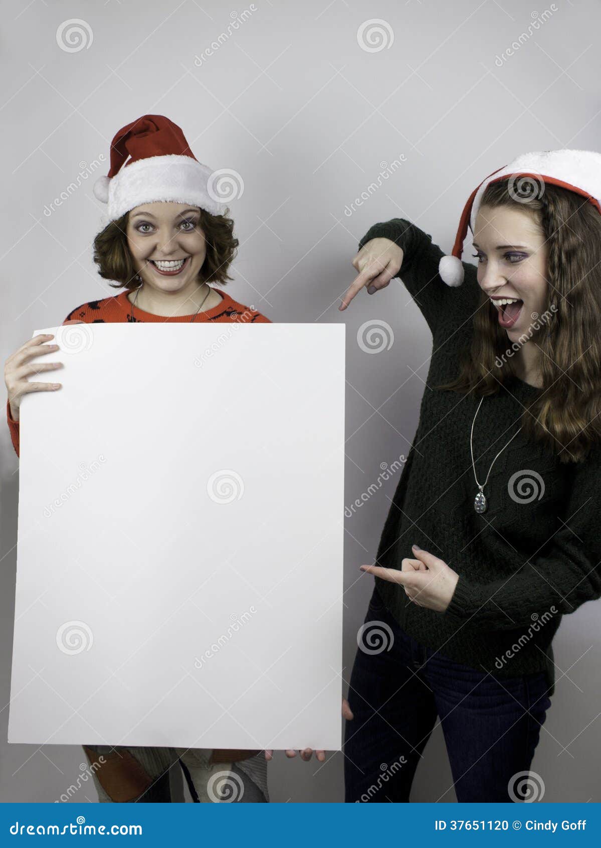 Two Pretty Woman Holding Sign Stock Photo - Image of caucasian, adult ...