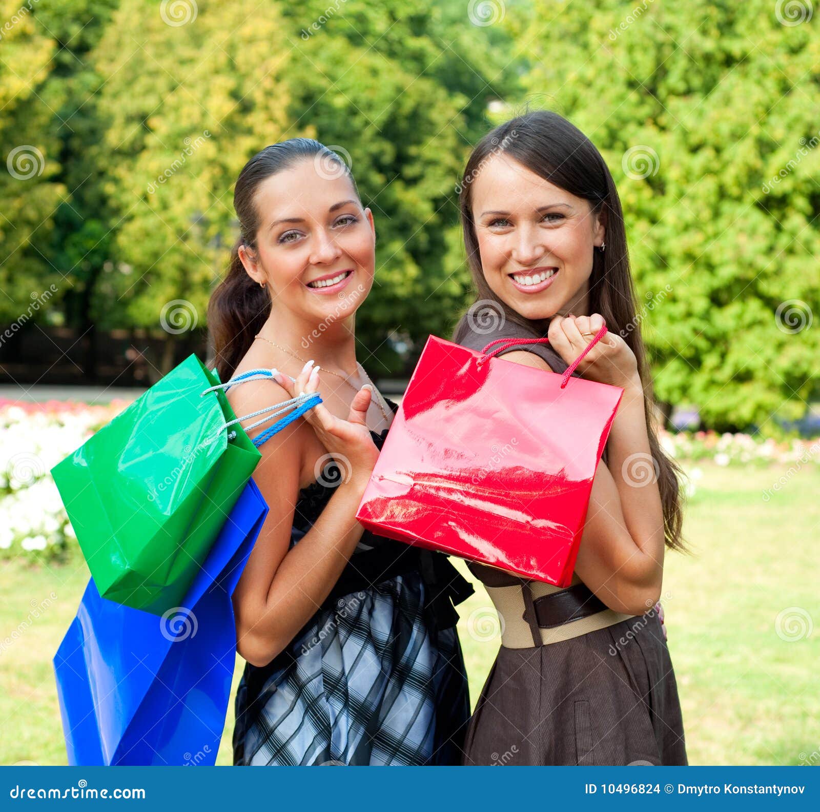 Two pretty women with bags stock photo. Image of fashion - 10496824