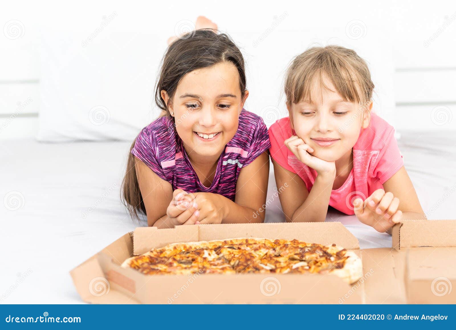 Two Pretty Young Girls Eating a Slice of Pizza Stock Photo - Image of ...