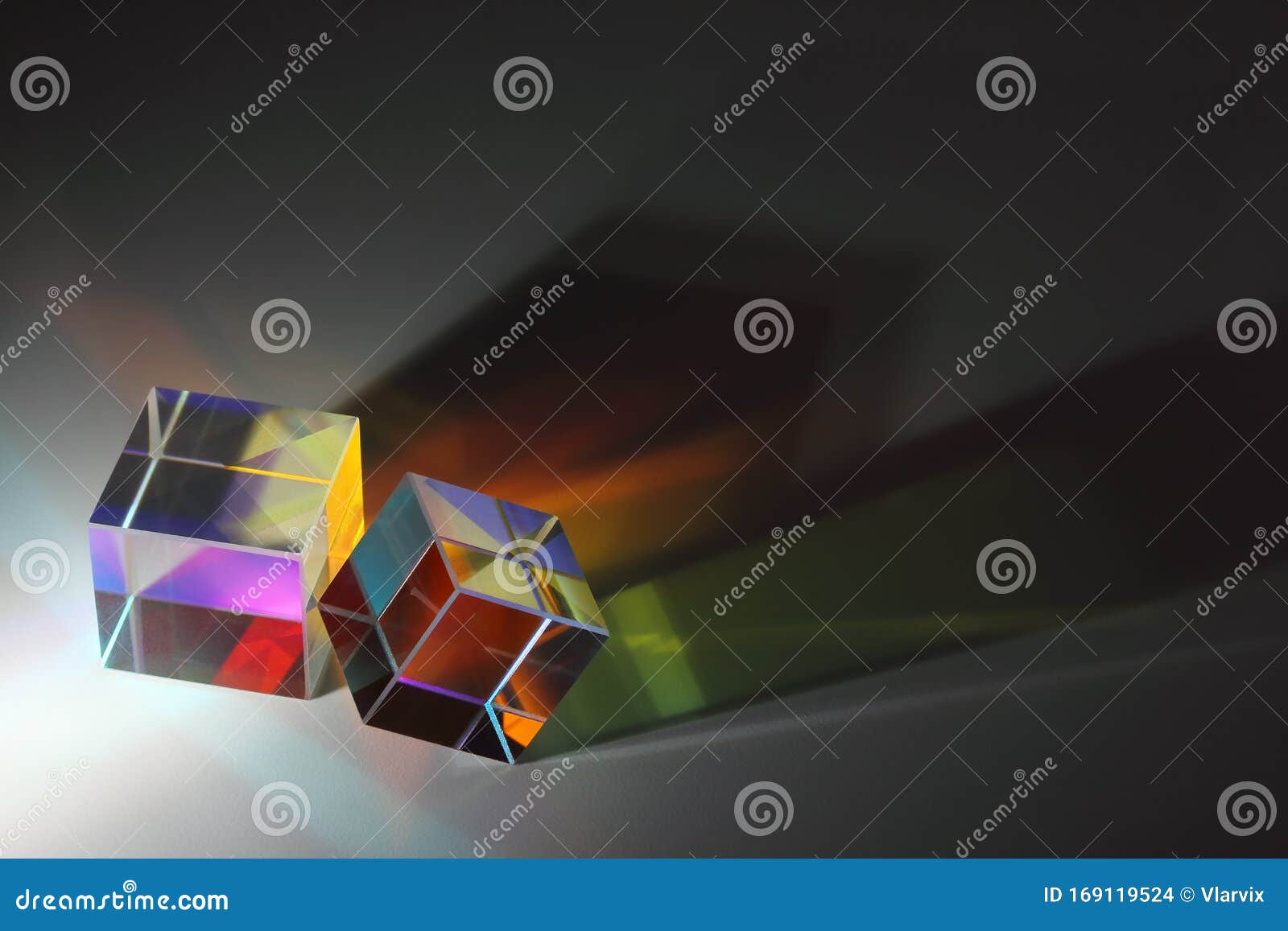 Two Prisms of the Cube are on the Surface and Cast Long Colored Shadows ...