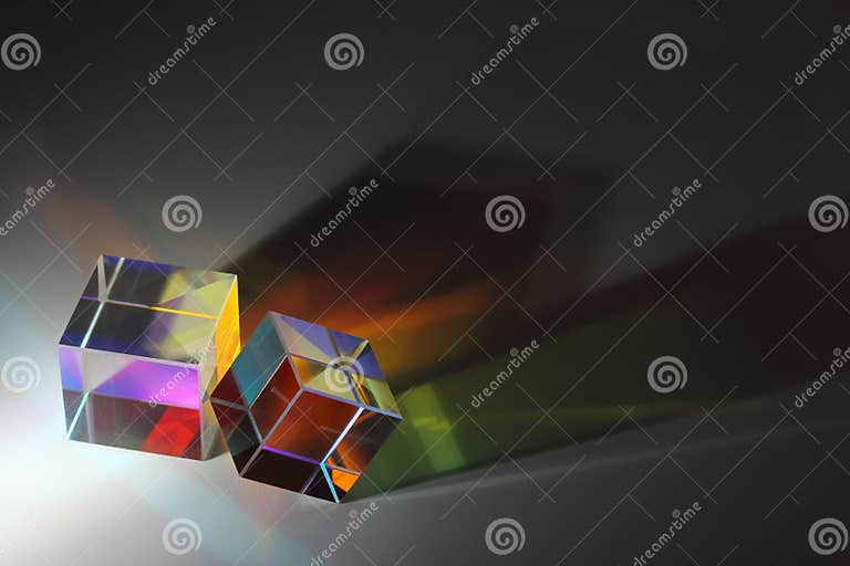 Two Prisms of the Cube are on the Surface and Cast Long Colored Shadows ...