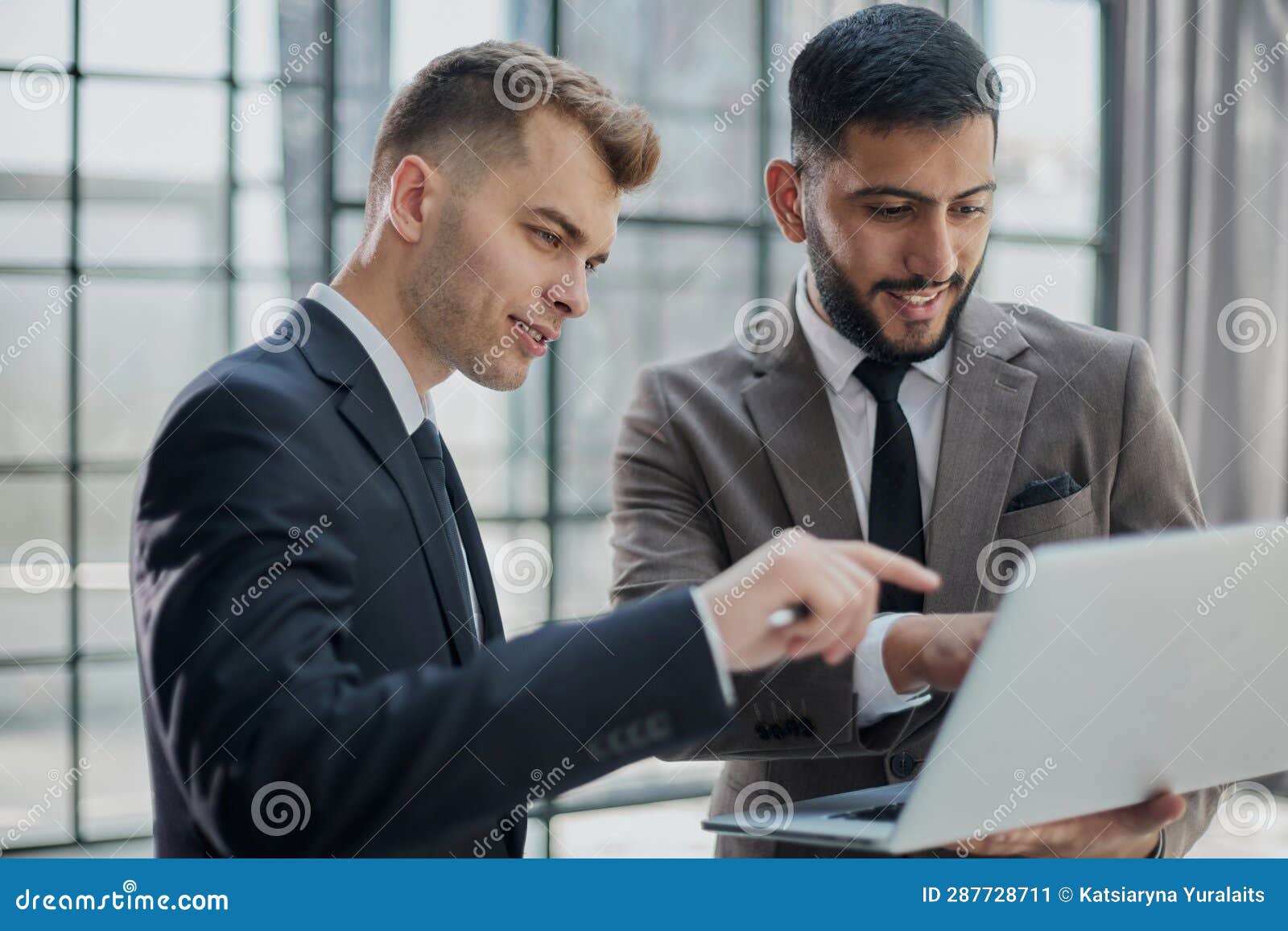 Two Professional Businessmen Discussing and Using Desktop Computer in ...