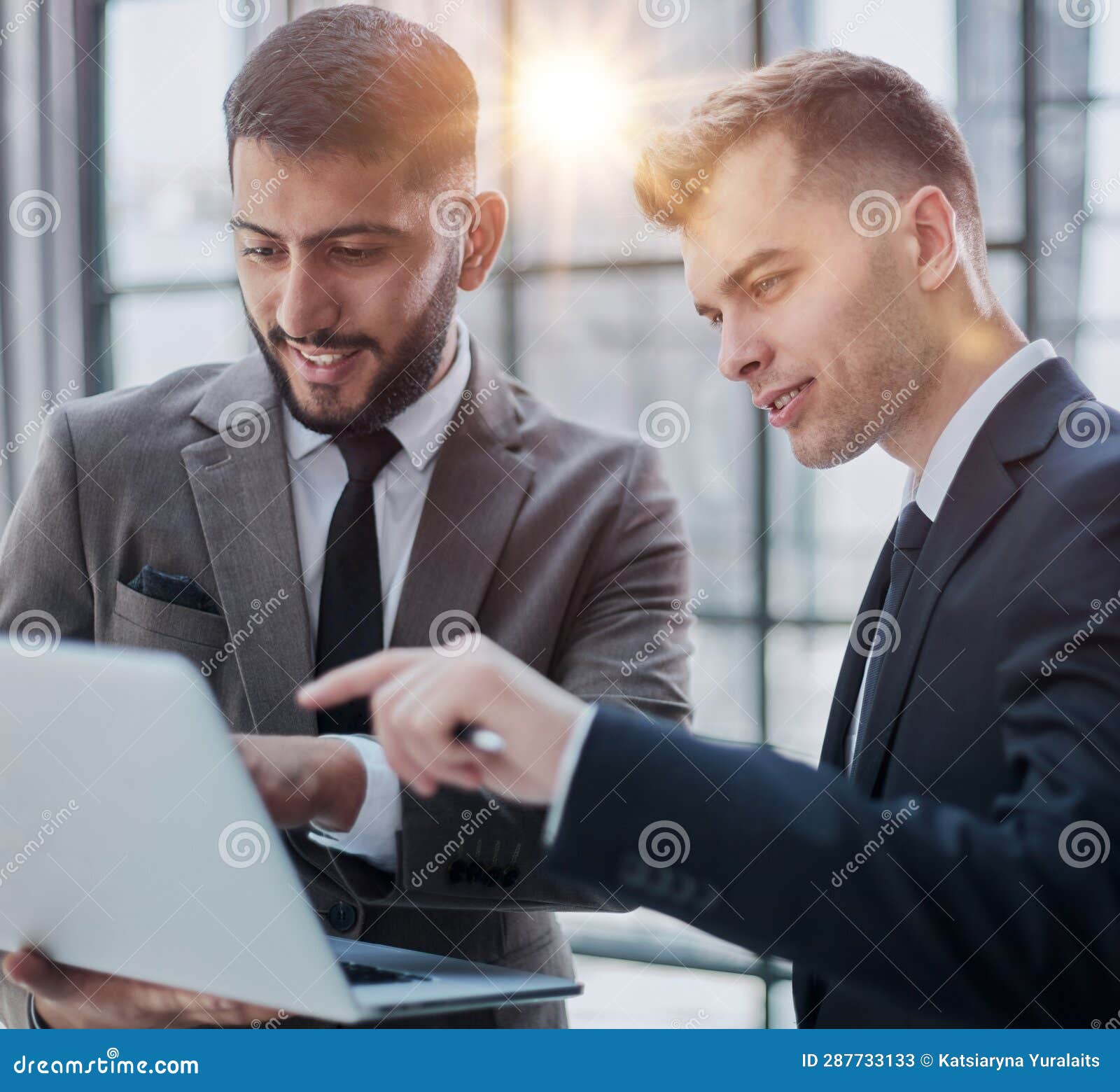 Two Professional Businessmen Discussing and Using Desktop Computer in ...