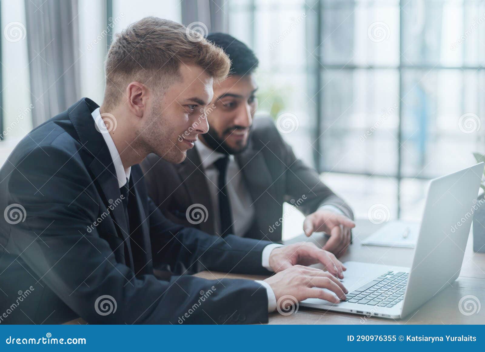 Two Professional Businessmen Discussing and Using Desktop Computer in ...