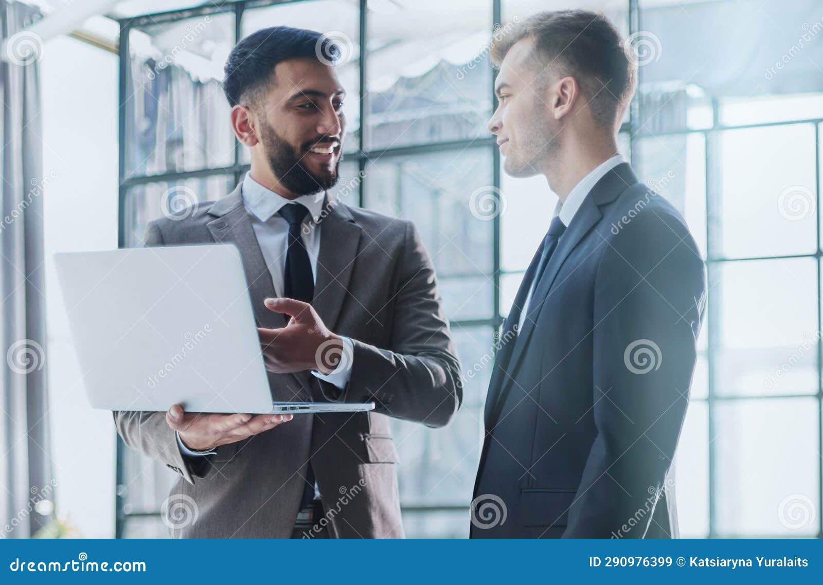 Two Professional Businessmen Discussing and Using Desktop Computer in ...