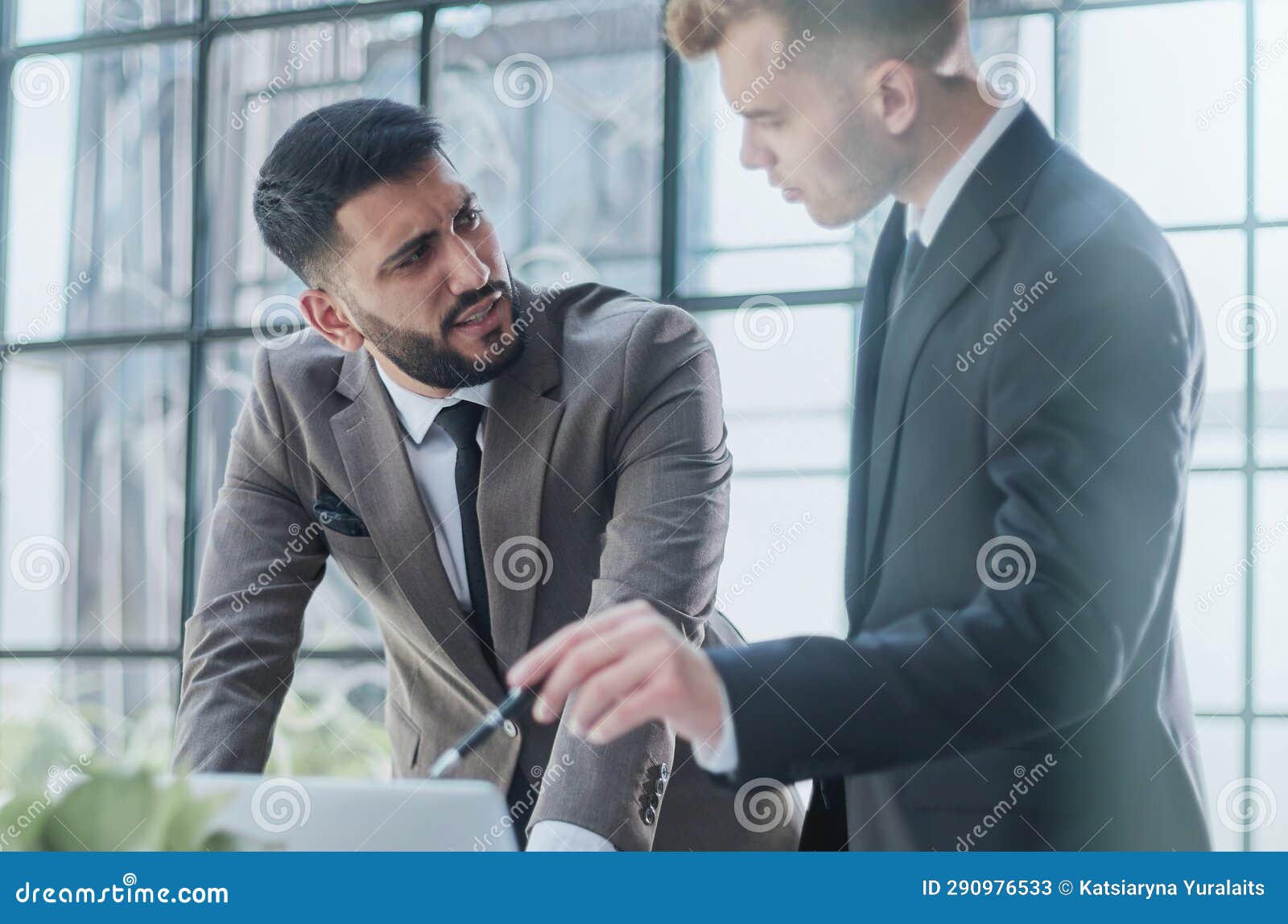 Two Professional Businessmen Discussing and Using Desktop Computer in ...