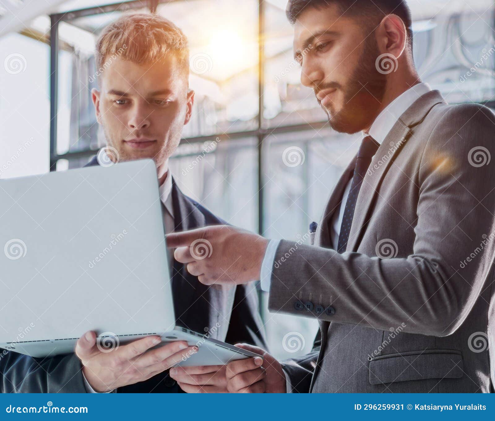 Two Professional Businessmen Discussing and Using Desktop Computer in ...