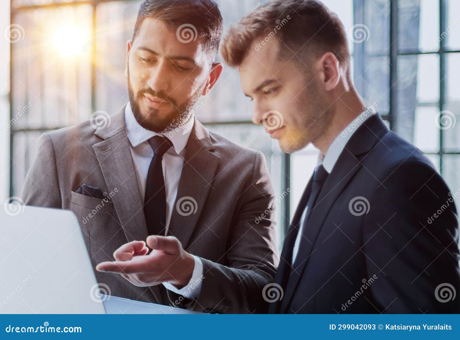 Two Professional Businessmen Discussing and Using Desktop Computer in ...