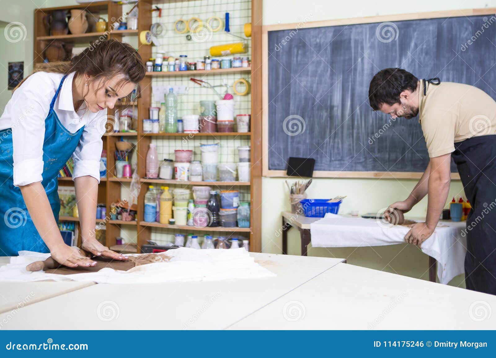 Two Professional Clay Makers during a Process of Clay Preparation on ...