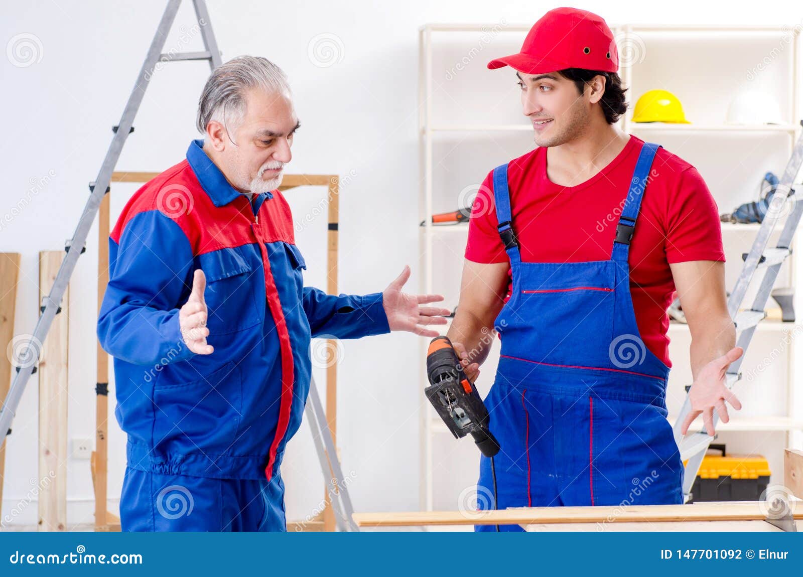 The Two Professional Contractors Laying Flooring at Home Stock Photo ...