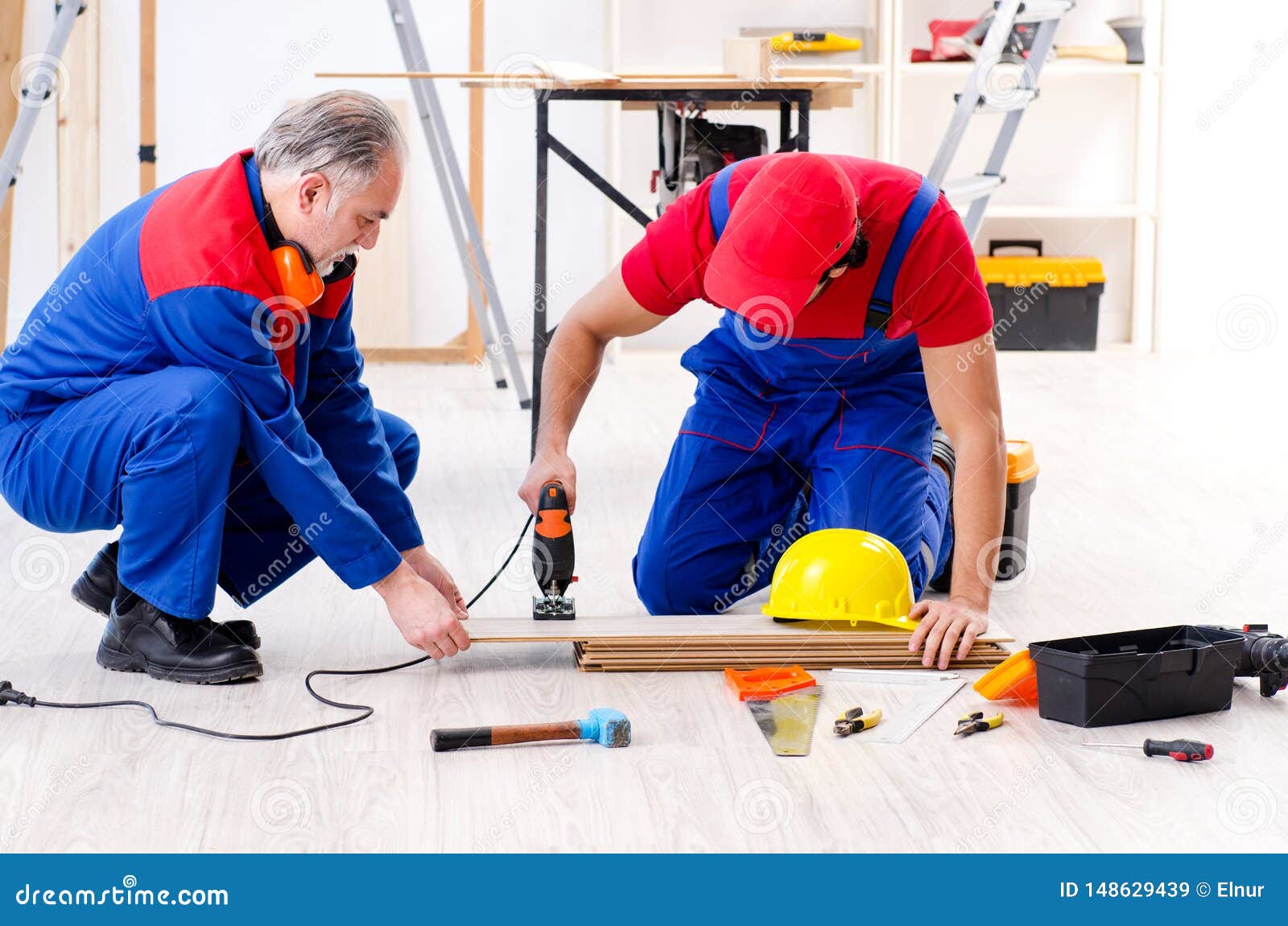 Two Professional Contractors Laying Flooring at Home Stock Image ...