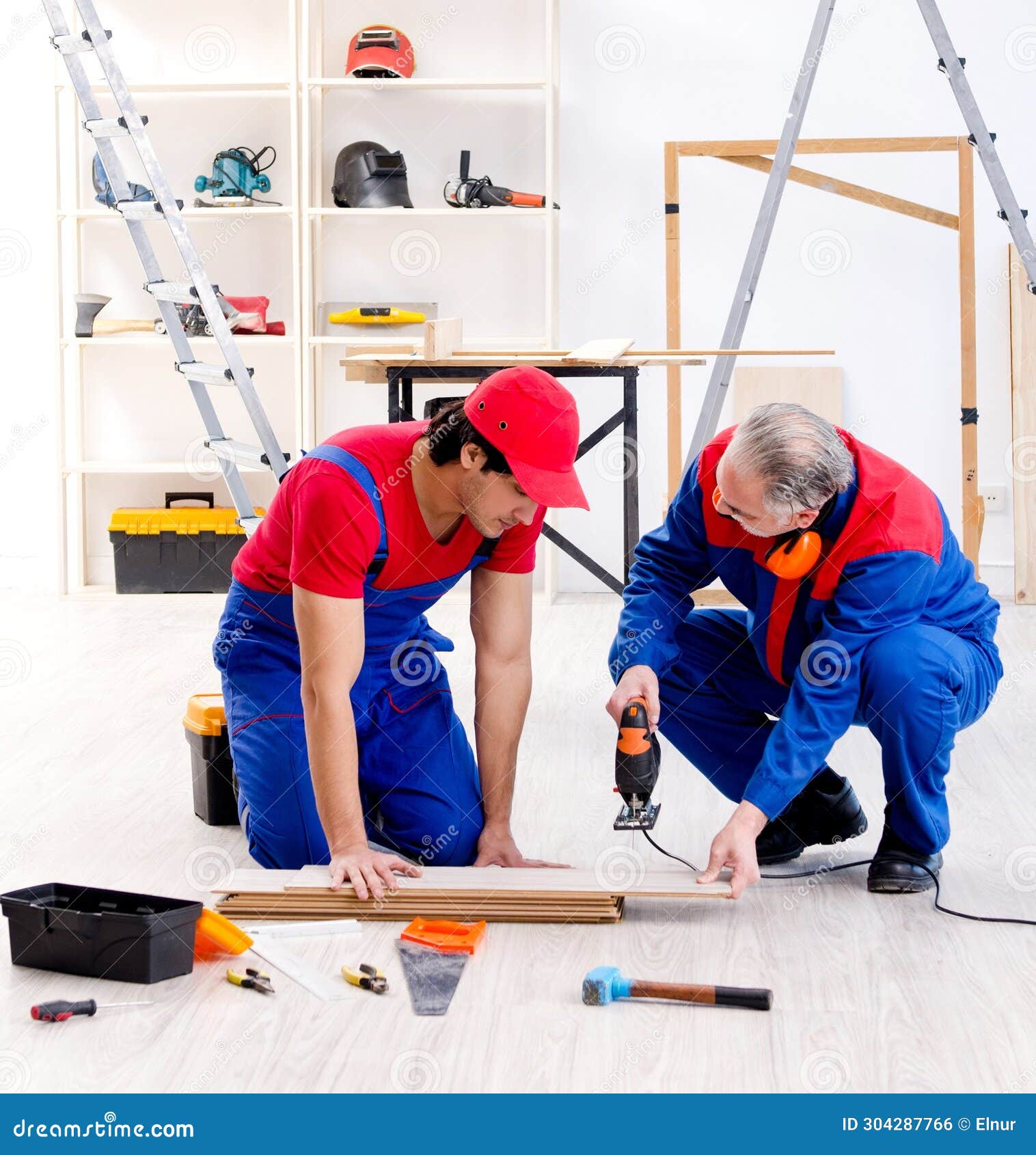 Two Professional Contractors Laying Flooring at Home Stock Photo ...