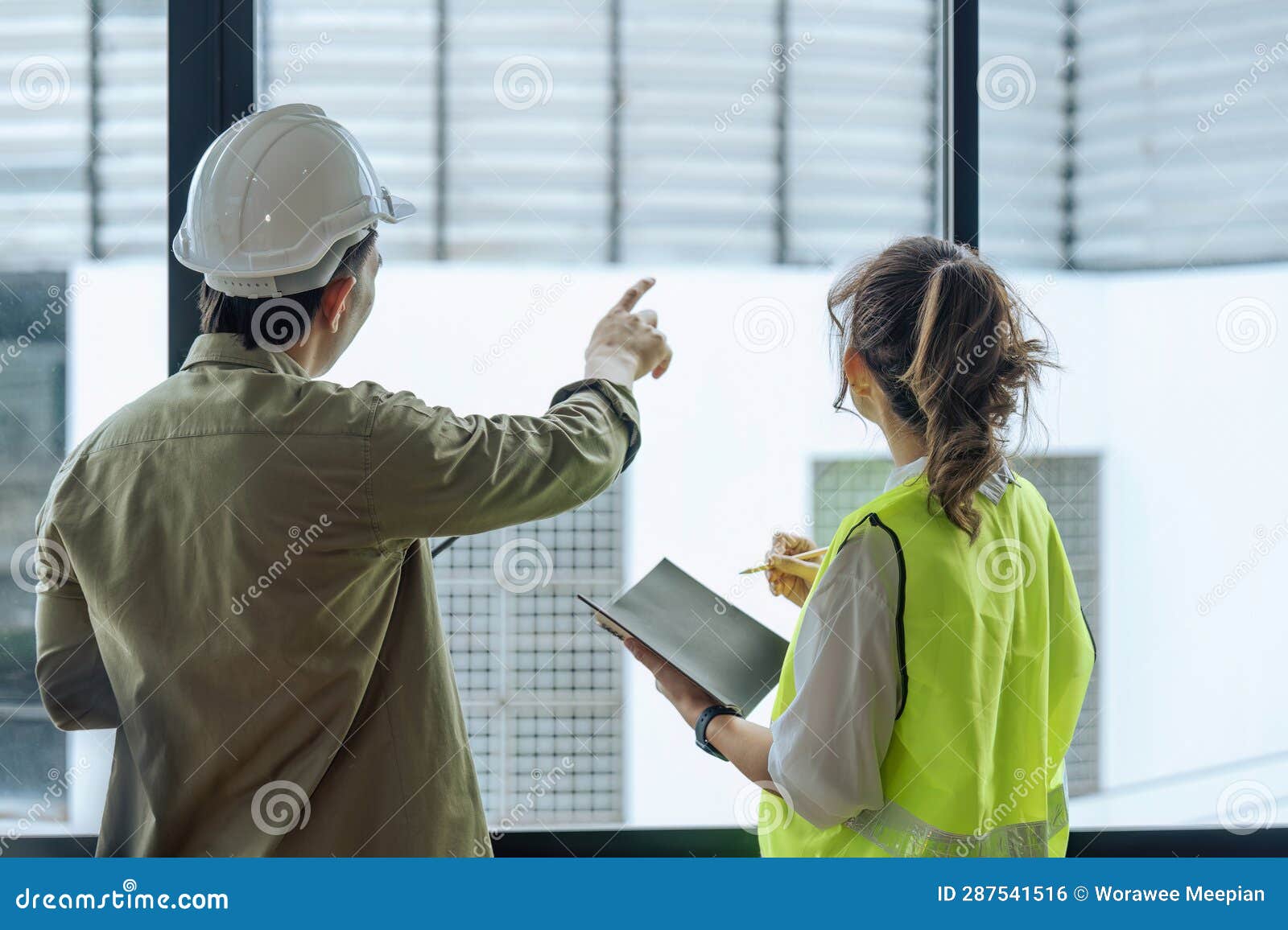 Two Professional Engineer and Architect in Safety Helmet Working ...