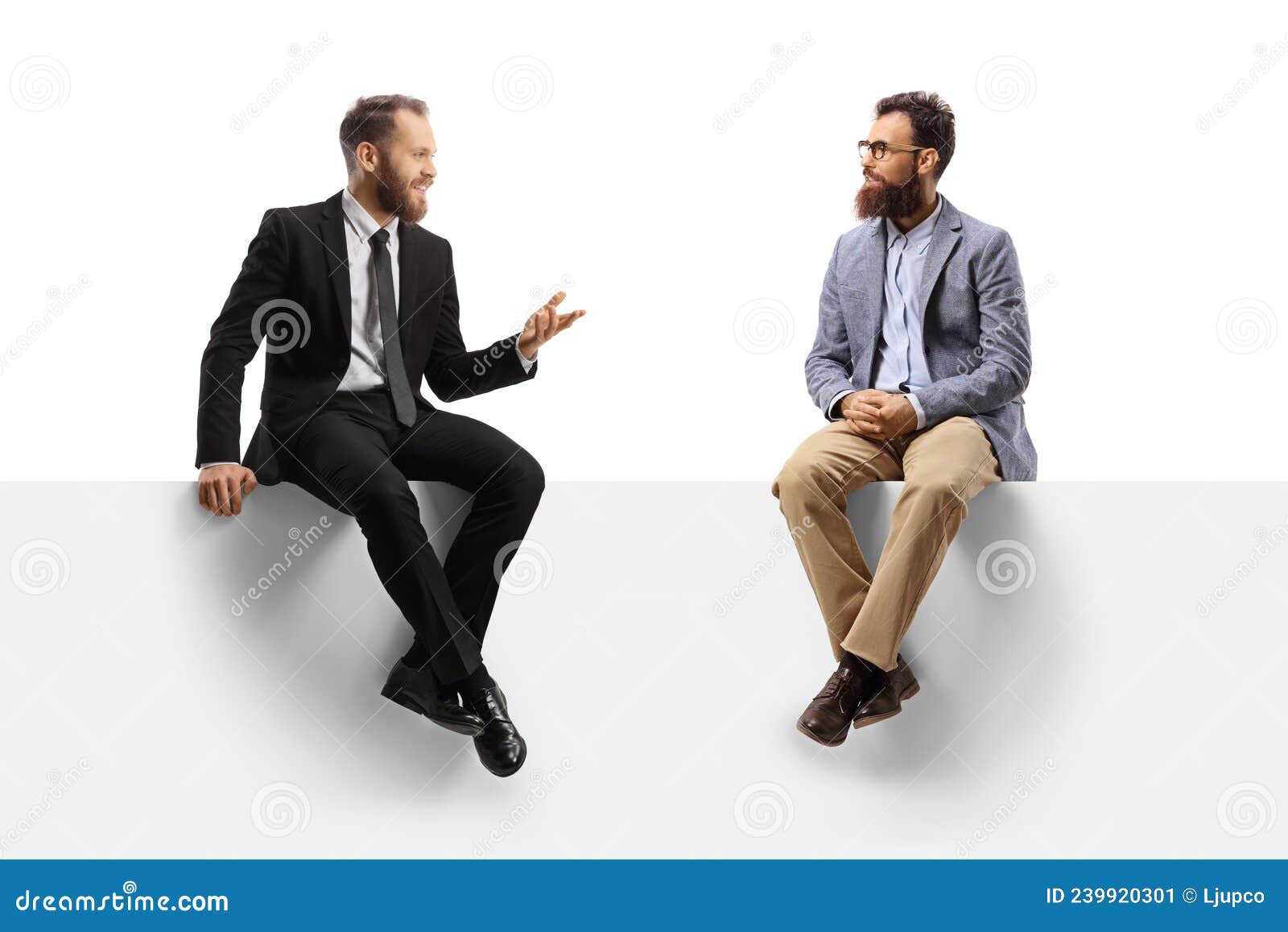 Two Professional Men Sitting on a White Panel and Having a Conversation ...