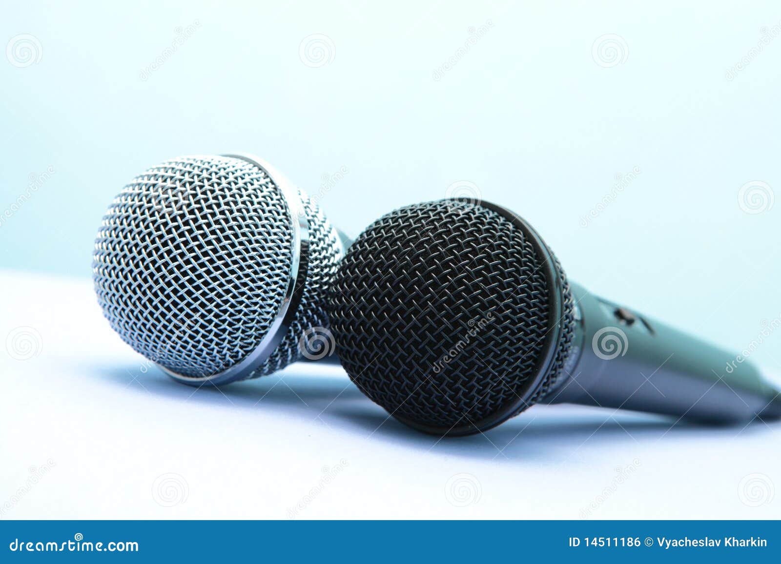 Two Professional Microphones on a Light Background Stock Photo - Image ...