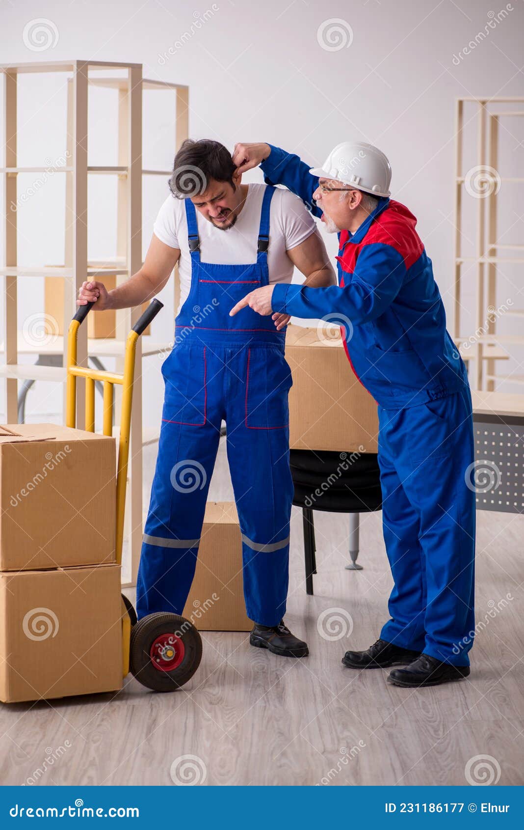 Two Male Professional Movers Doing Home Relocation Stock Image - Image ...