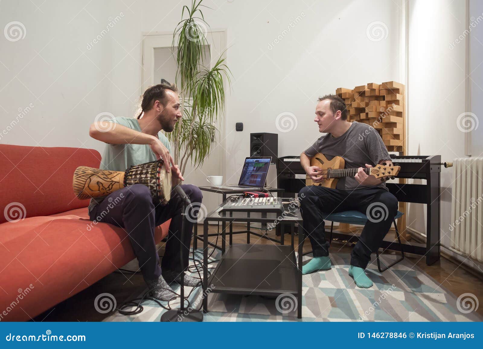 Two Musicians Playing Instruments in Home Music Studio Stock Photo ...