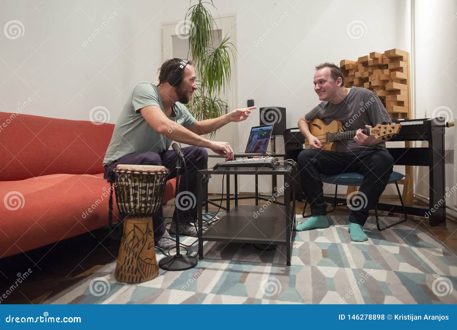 Two Musicians Playing Instruments in Home Music Studio Stock Photo ...