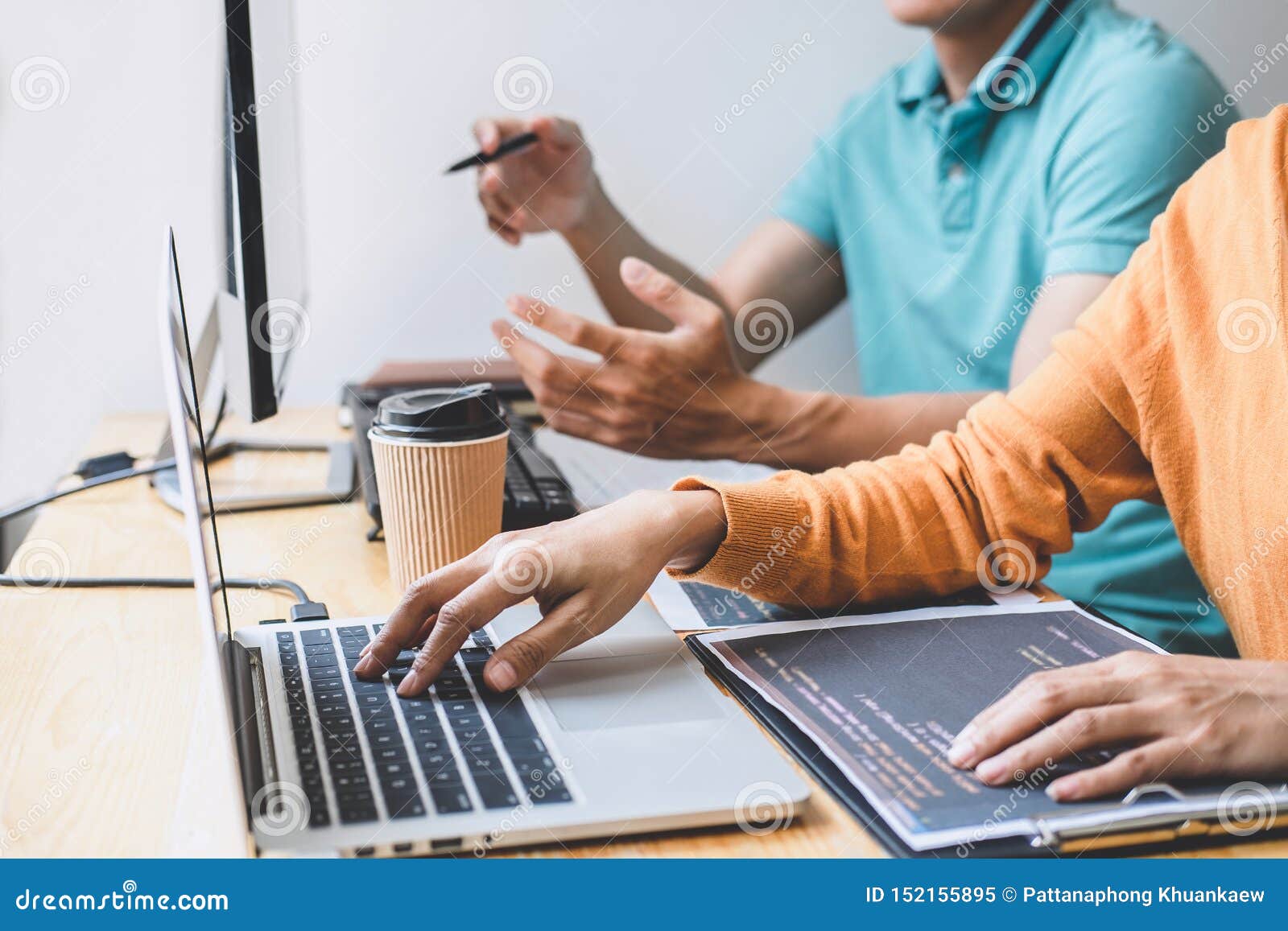 Two Professional Programmer Cooperating And Working On Web Site Project In A Software Developing