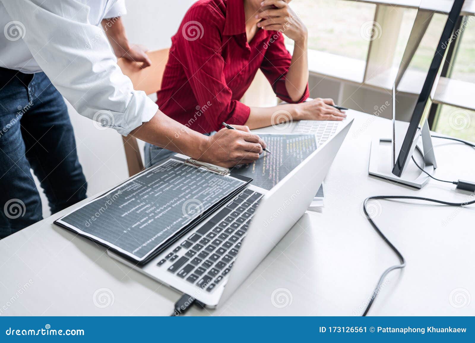 Two Professional Programmer Cooperating And Working On Web Site Project In A Software Developing