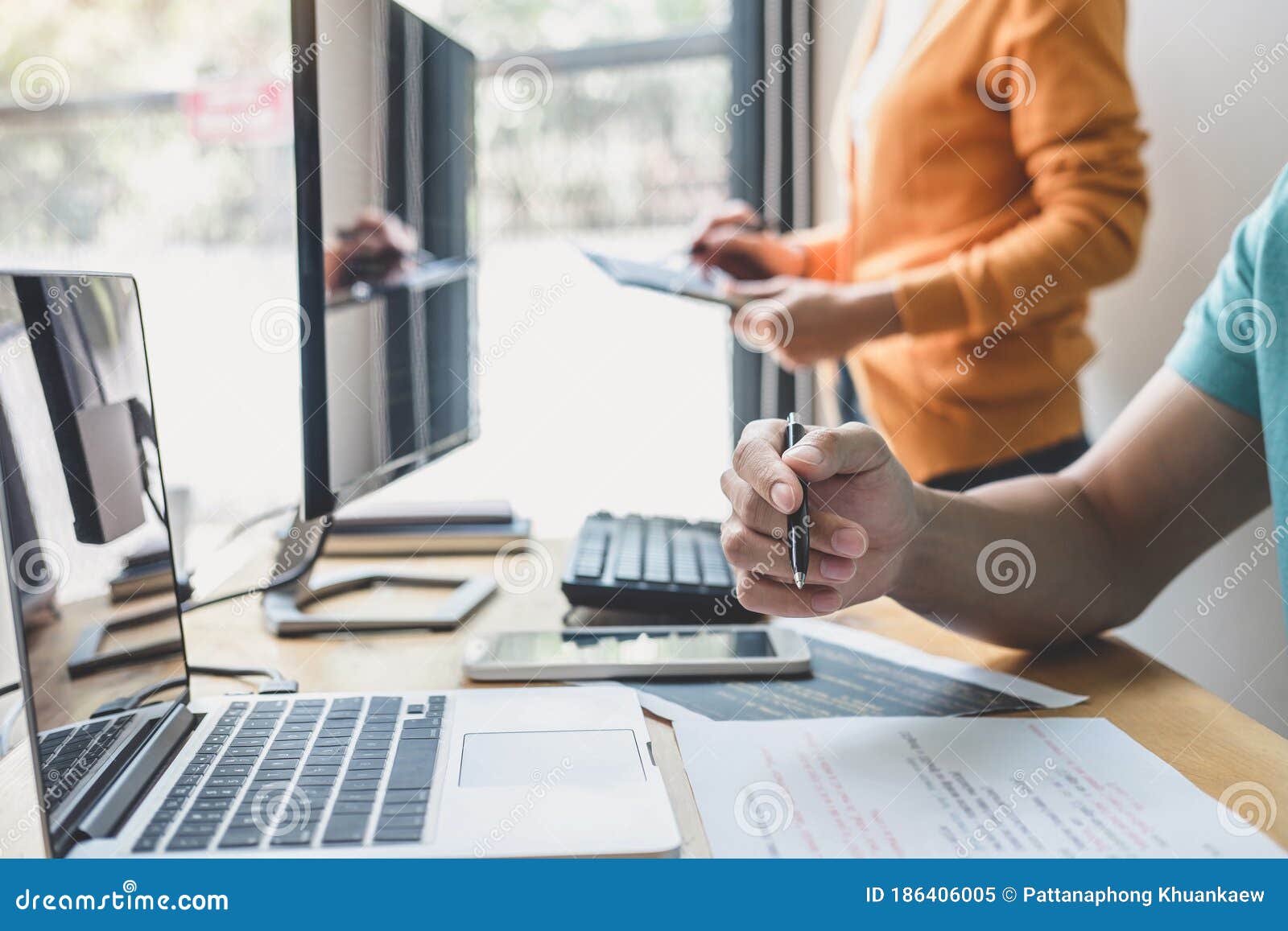 Two Professional Programmer Cooperating And Working On Web Site Project In A Software Developing