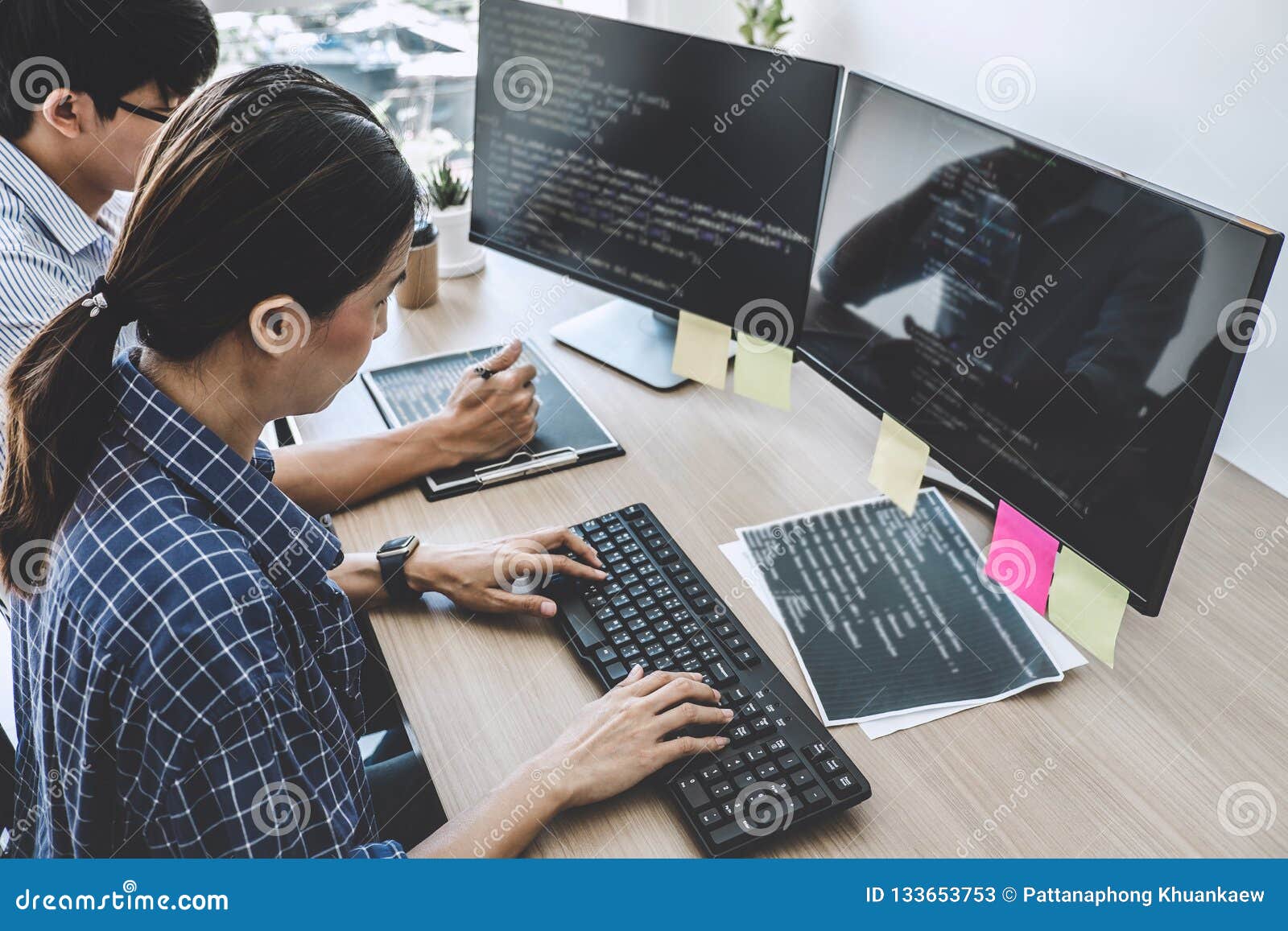 Two Professional Programmers Cooperating at Developing Programming and Website Working in a ...