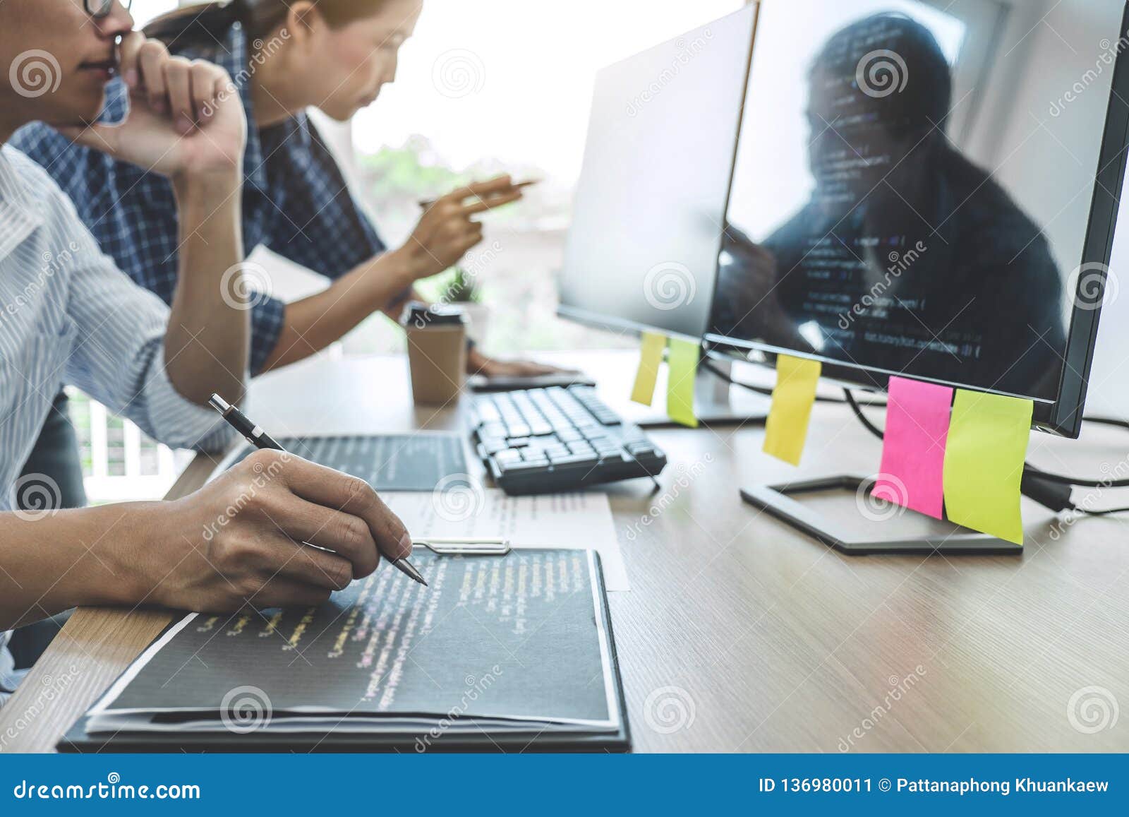 Two Professional Programmers Cooperating At Developing Programming And Website Working In A