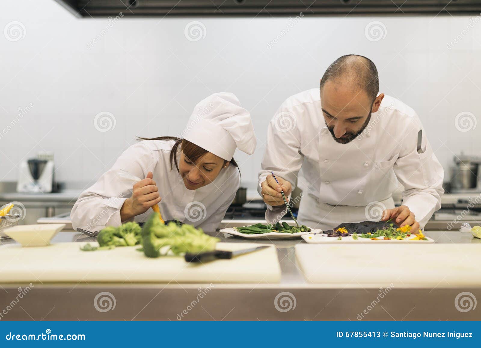 Two Professionals Chefs Cooking Together. Stock Image - Image of ...
