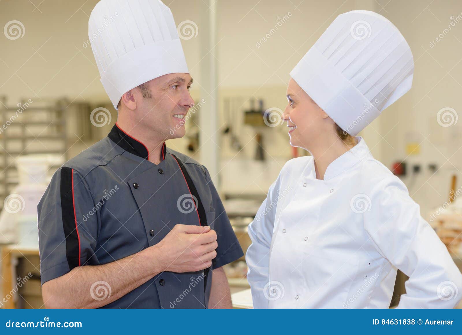 Two Professionals Chefs Talking and Smiling in Kitchen Stock Photo ...