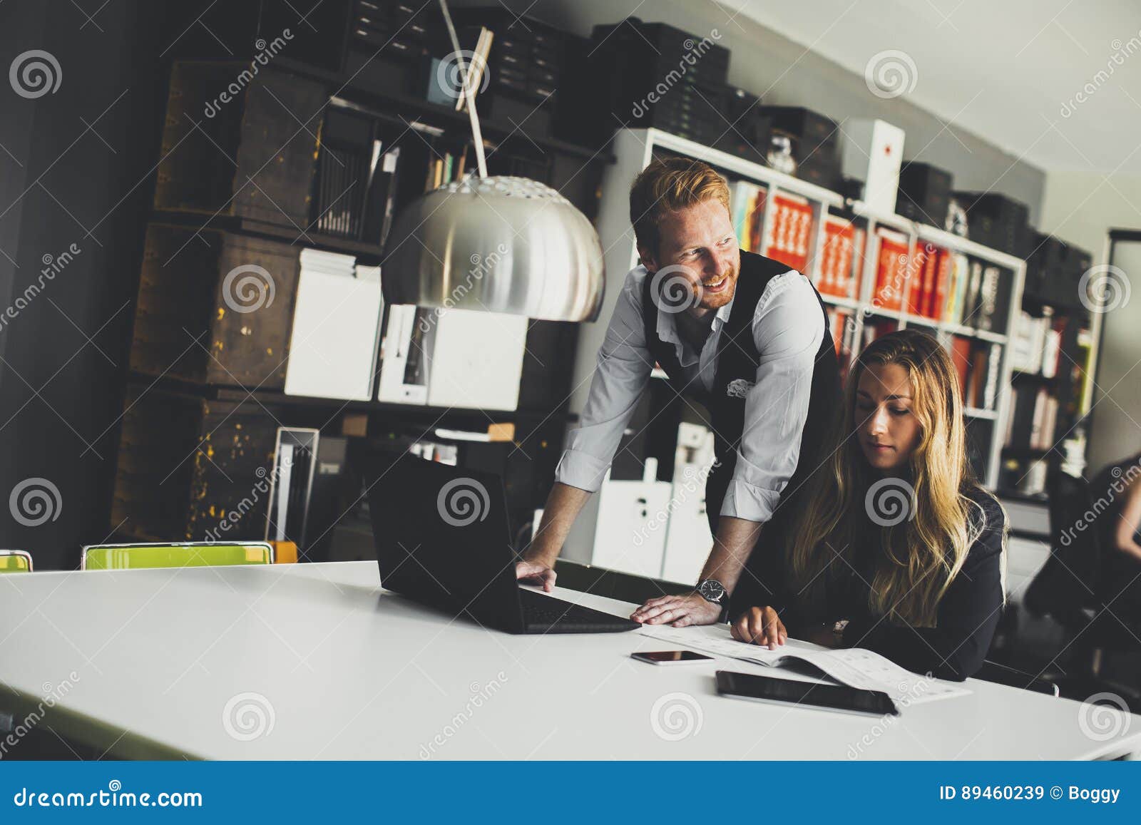 Two Professionals Looking at a Laptop Screen Stock Image - Image of ...