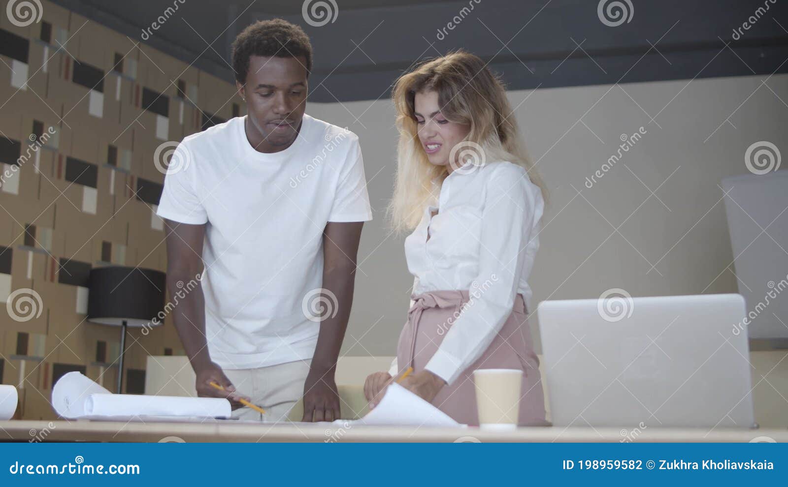 Two Professionals Standing at Table and Talking Stock Footage - Video ...