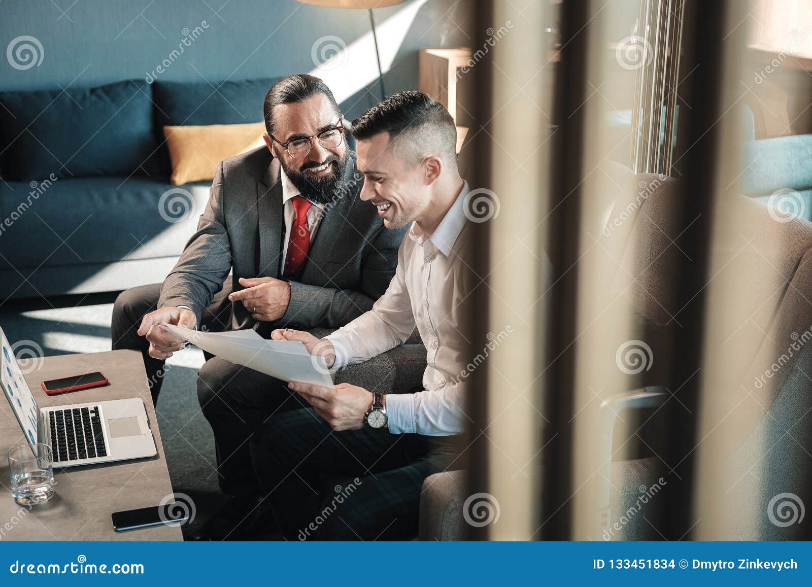Two Prosperous Business Partners Laughing while Communicating Stock ...