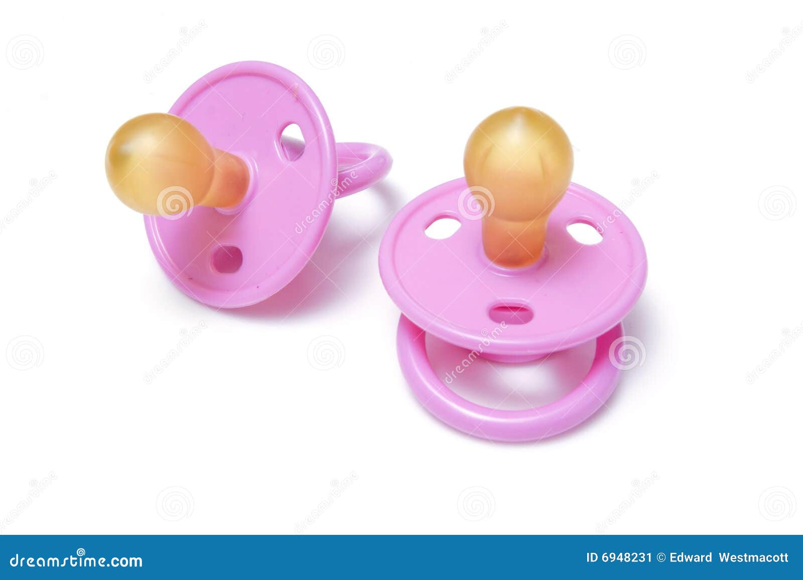 Two purple dummies stock image. Image of soothers, nipple - 6948231